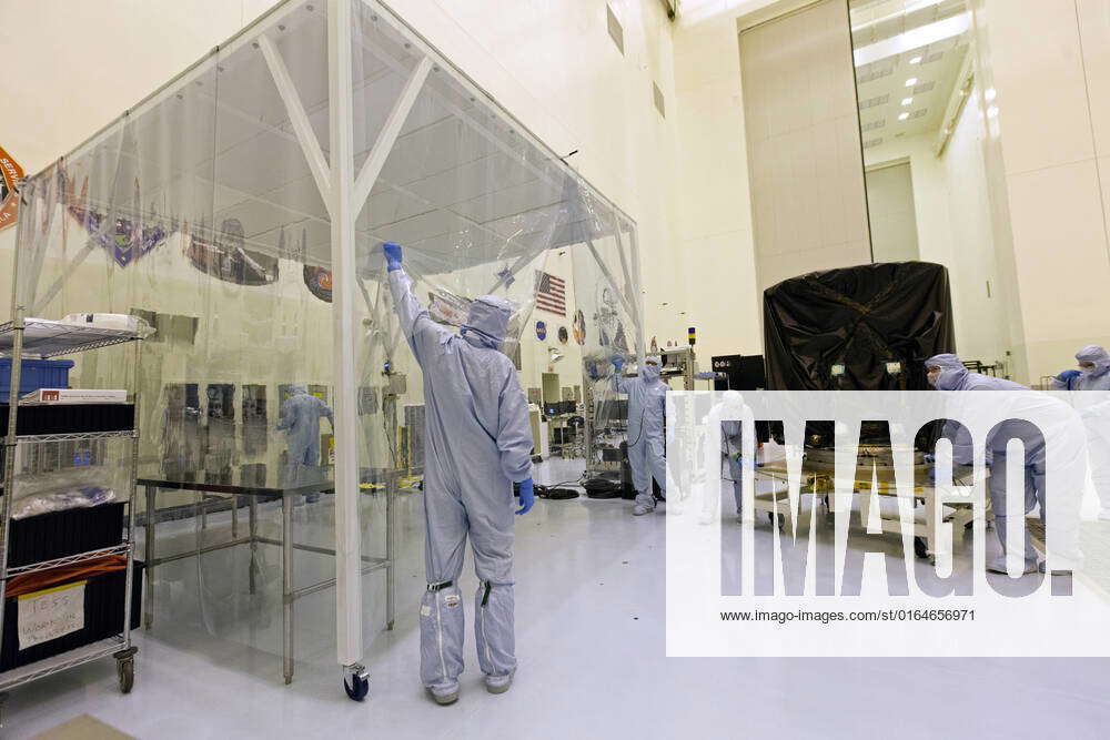 Technician dressed in clean room suits move NASA s Transiting Exoplanet ...