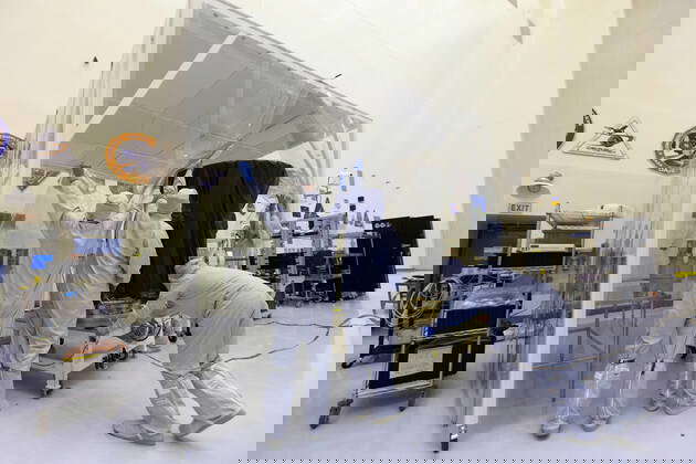 Technician dressed in clean room suits move NASA s Transiting Exoplanet ...