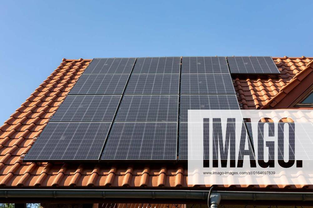 Solar electric panels on a house roof i, Solar electric panels on a ...