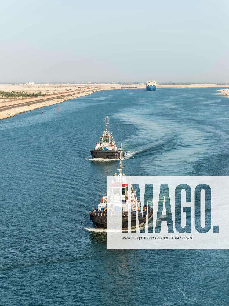 Traffic on the Suez Canal in Egypt, El Qantara, Egypt - November 14, 2019: Tugboats accompanies the