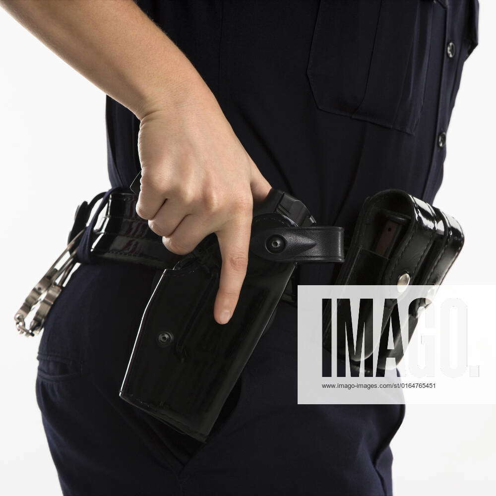 Close up side view of mid adult female Caucasian law enforcement ...