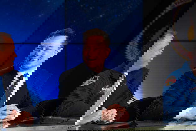 SpaceX Chief Engineer Elon Musk, right, speaks to NASA Administrator ...