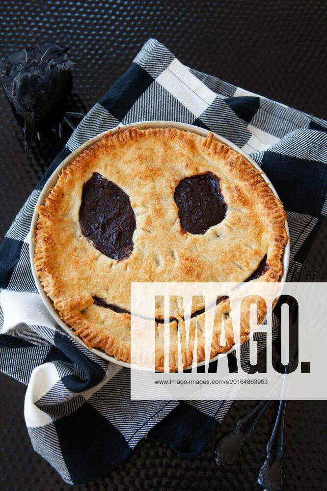 Homemade cherry pie, Homemade cherry pie with a scary face for Halloween