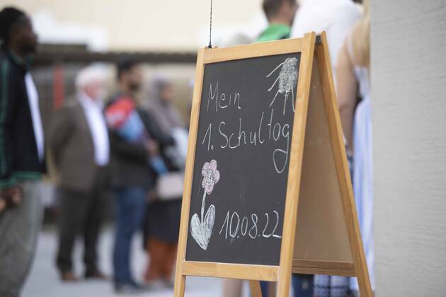My first day at school, is written on a board, on the schoolyard of the ...
