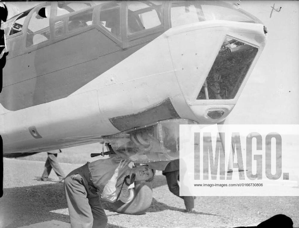 Royal Air Force Bomber Command, 1939-1941. An armourer attends to the ...