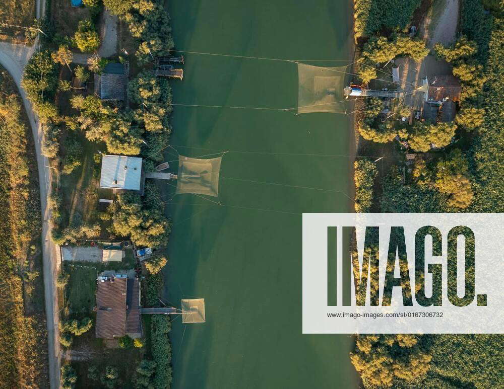 Birds view of fishing huts on river, Birds view of fishing huts on ...