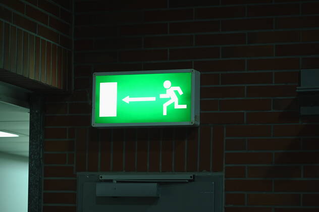green sign escape route, emergency exit with