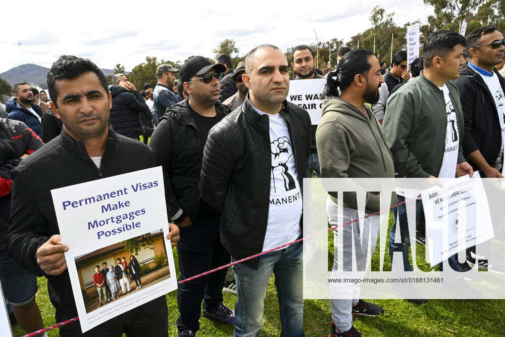 Canberra Refugees Rally Attendants Hold Signs During A Rally For