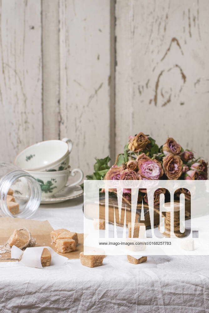 Fudge candy Fudge candy and caramel on baking paper and in glass jar ...