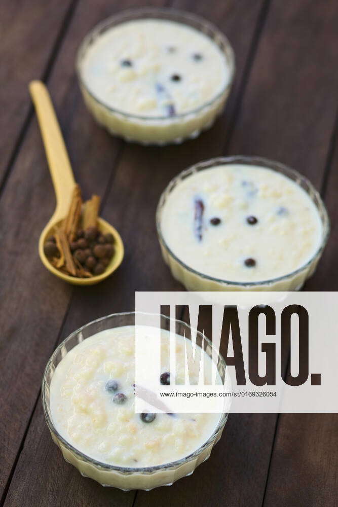 Three glass bowls of the Ecuadorian dessert called morocho (coarsely ...