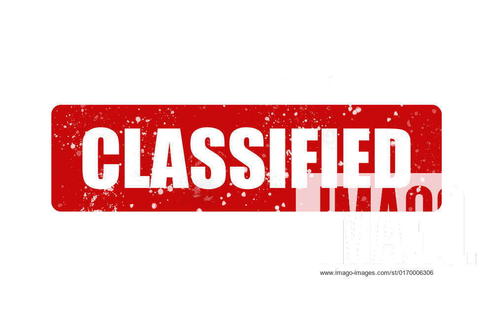 Classified sign, red stamped. Red background with white letters. Some ...