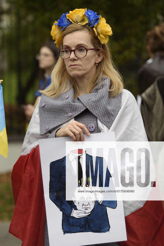 Warsaw, Warsaw, Poland: A woman holds a drawing depicting Russian ...
