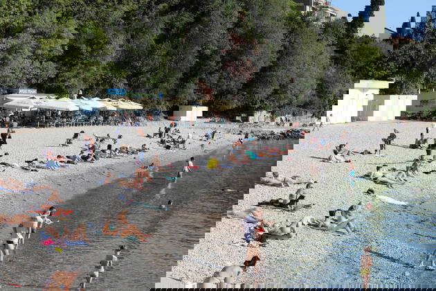 Sunny autumn day at the beach The city beach on Kantrida is full of ...