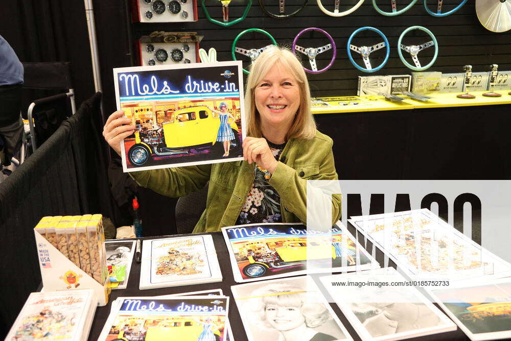 Actress Candy Clark signs autographs for fans during the 2022 SEMA Show ...