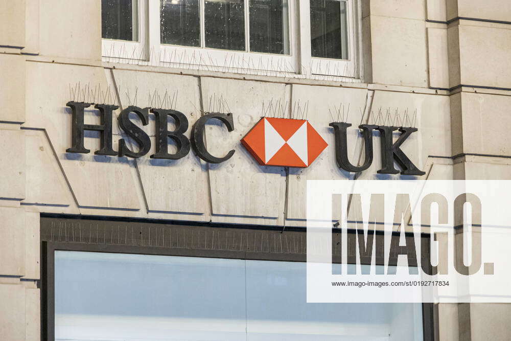 HSBC Holdings Plc Bank Branch In London A logo at a HSBC bank. Night ...