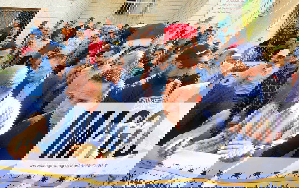 Palestinians carry the body of Fatima Bernawi during her funeral ...