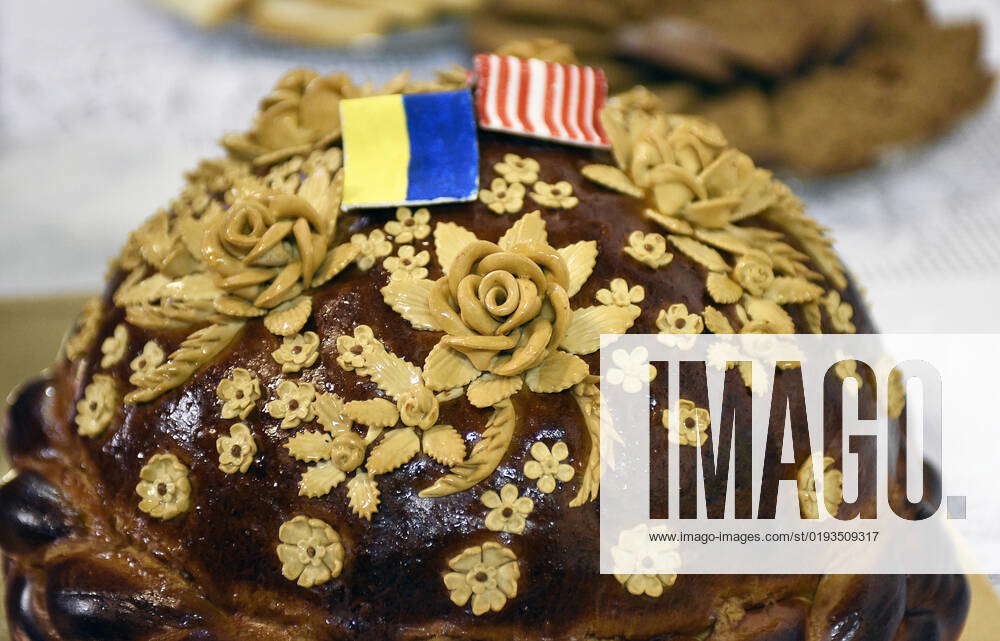 KYIV, UKRAINE - A welcoming korovai bread with Ukrainian an US flags on ...