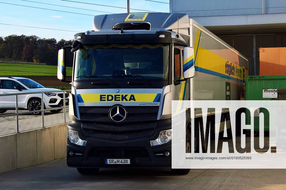 Edeka grocery truck, Mercedes Actros with a trailer at the loading ramp ...