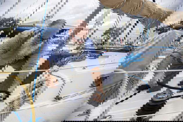 Tampa, Florida, USA: Jon Procter of Ozona, ties down his sailboat ahead ...