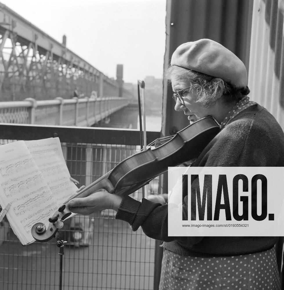 Busker playing the violin, Hungerford Bridge, Lambeth, London, c1946 ...