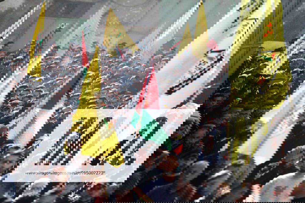 Palestinians carry the body of Raafat Issa, who was shot killed by ...