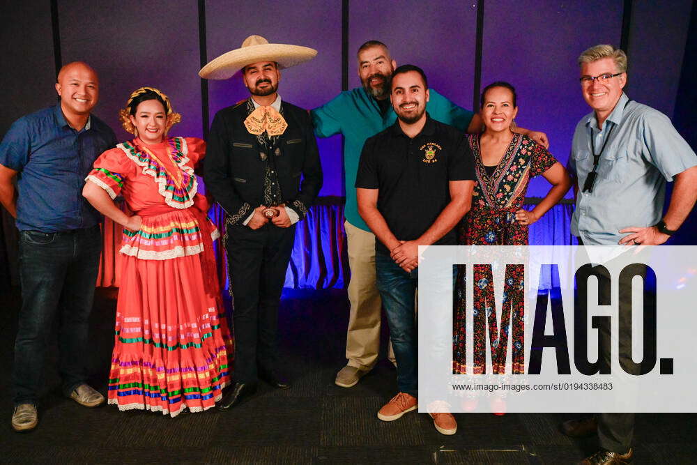 Service members of Naval Surface Warfare Center, Corona Division, pose for a photo after a video