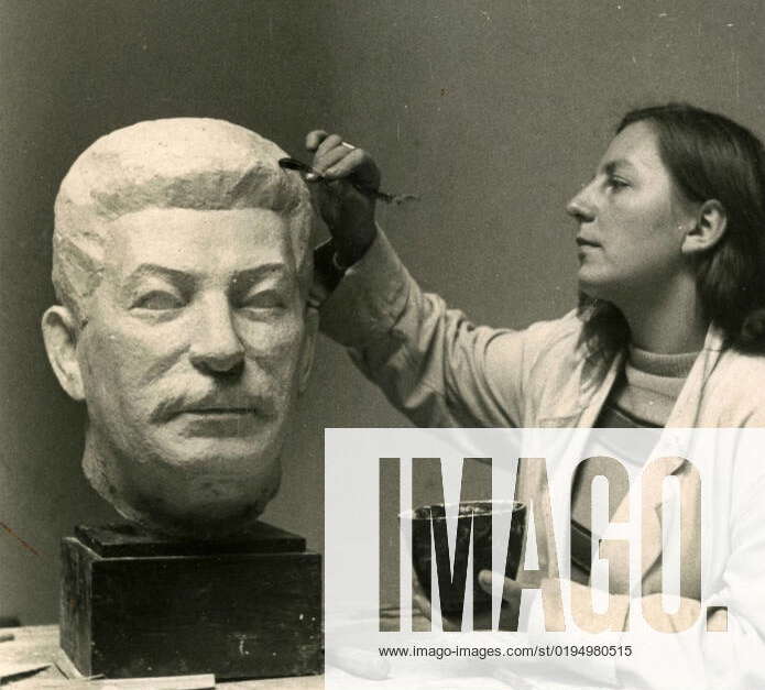 German artist Ruthild Hahne finishing his Stalin head artwork, Berlin ...