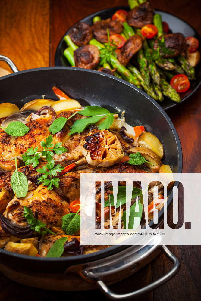 Roasted roasted rabbit on vegetables in pan Roasted roasted rabbit on ...