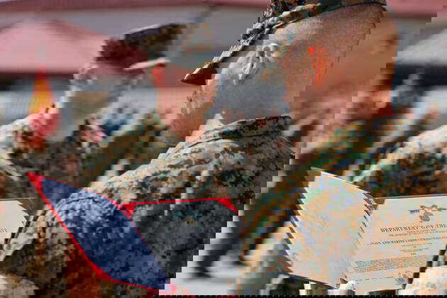 U.S. Marine Corps Gunnery Sgt. Colin G. Baird, a geospatial analyst ...