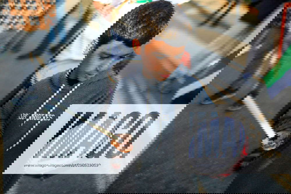 Protesters raise placards and Palestinian flags during a rally ...
