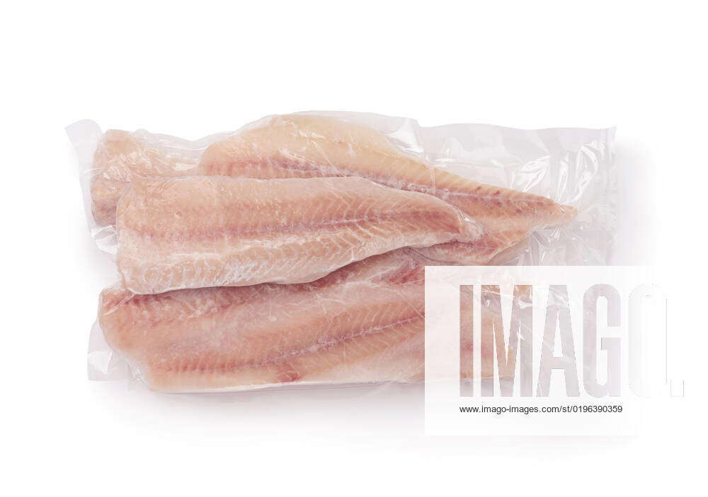 Frozen pollock fillet in airtight clear plastic bag Top view of frozen ...