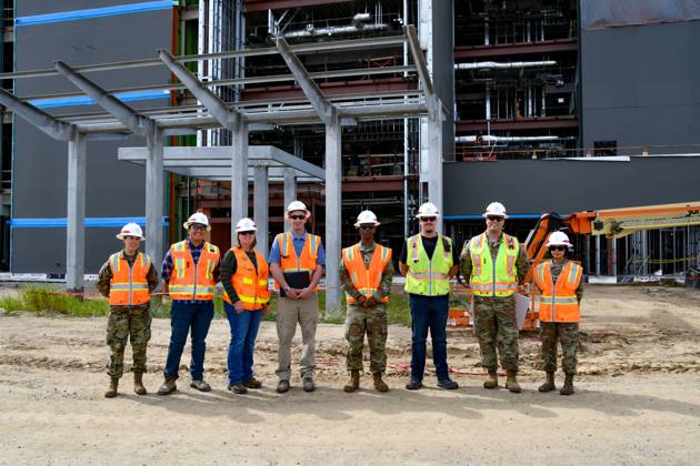 Employees and service members with the U.S. Army Corps of Engineers Sacramento District listen to