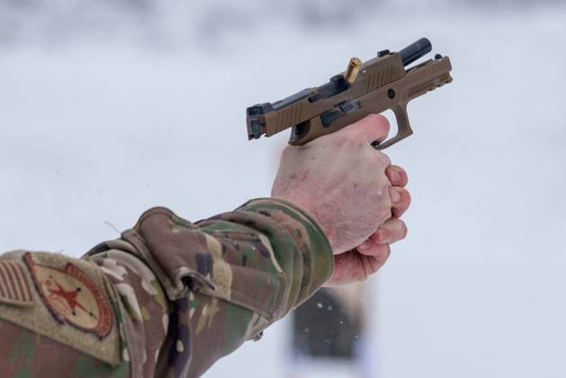 A U.S. Air Force Airman assigned to the 673d Security Forces Squadron ...