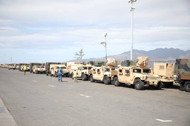 As part of the Army Prepositioned Stock 3, military vehicles are staged ...