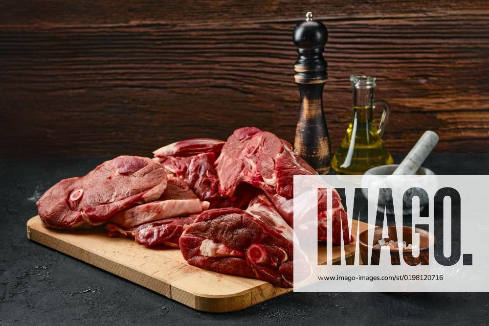Assortment of raw lamb meat on wooden tray, Assortment of raw fresh ...