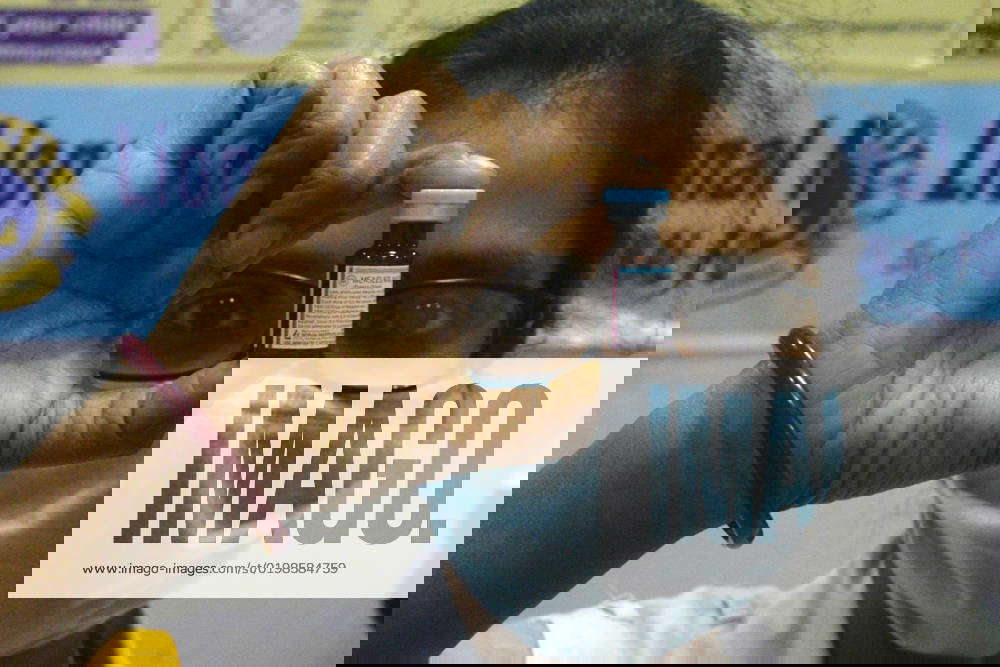 Measles and Rubella vaccination drive Heath worker holds vial of Measle ...