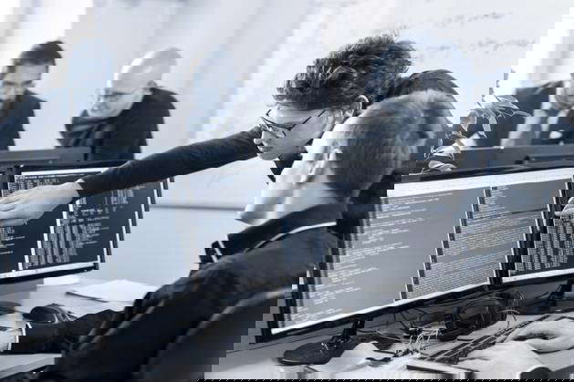 Startup business problem solving. Software developers working on desktop computer. Startup business