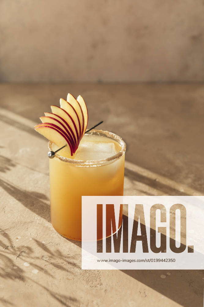Spiced apple drink with sliced apple garnish. Spiced apple drink with ...