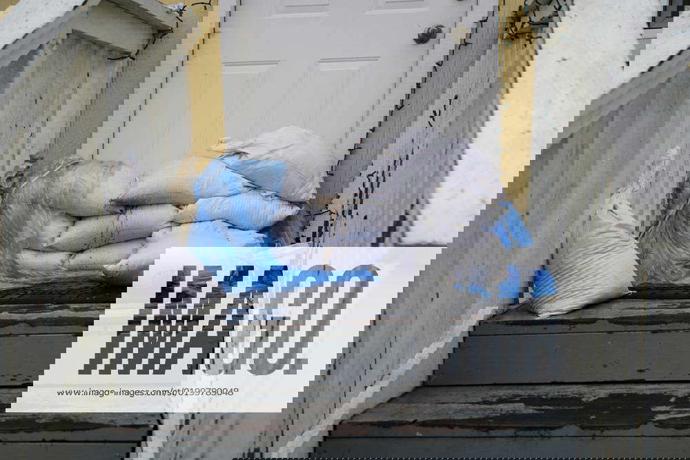 Watsonville, California, United States: People put sandbag outside ...