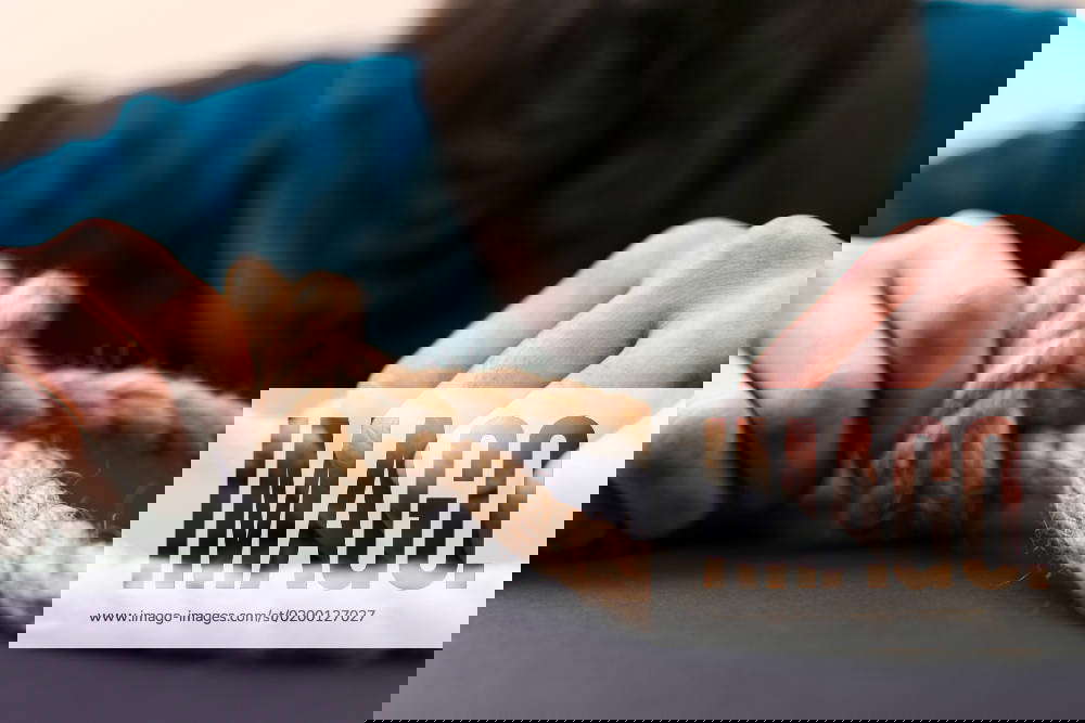 A man holds a loop of rope in his hands. A mental health day., model ...