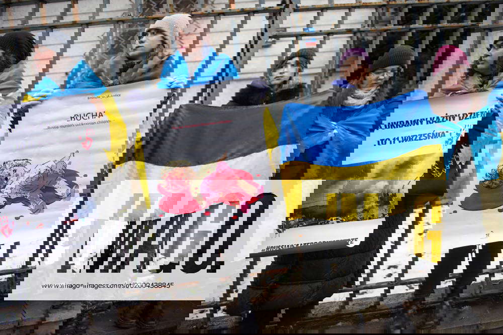 Warsaw, Poland: Protesters hold posters and Ukrainian flags during the ...