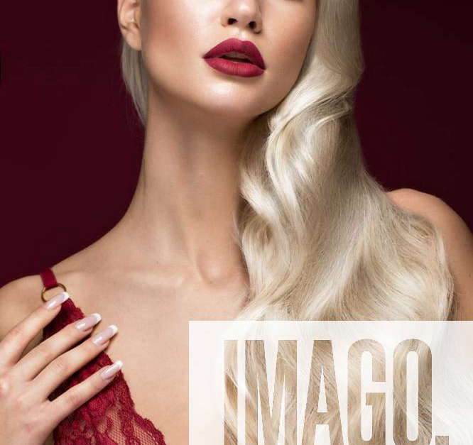Beautiful Blonde In A Hollywood Manner With Curls Red Lips Lingerie