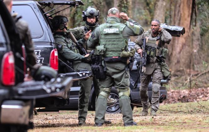 : Members of the Atlanta police SWAT team gather at Gresham Park on ...