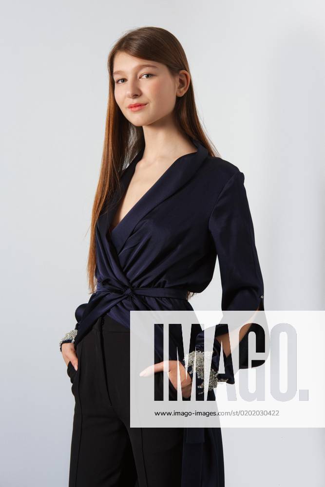 attractive Fashion model in Pants, Blouse at Sponsors holds the Hands ...