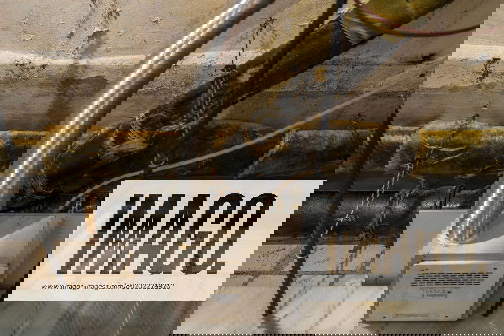 Defective water and sewage pipes running under a ceiling Water damage ...