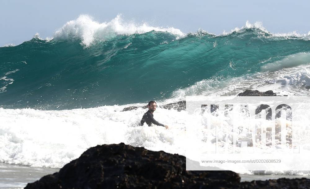 CYCLONE GABRIELLE SWELL, Surfers are seen at Snapper Rocks on the Gold ...