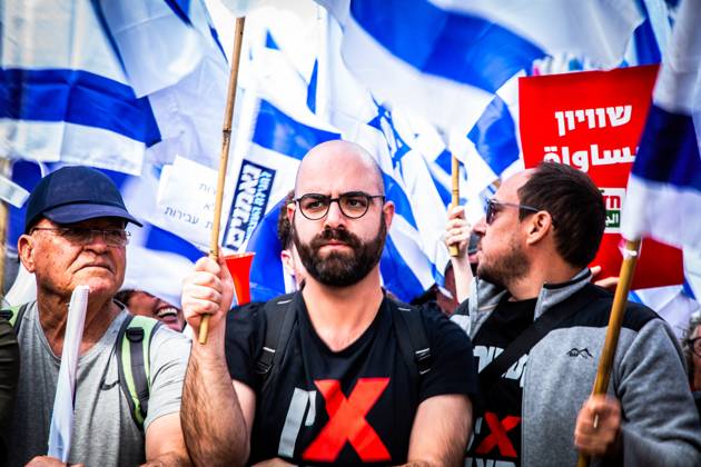 February 20, 2023, Jerusalem, Israel: Protestors wave Israeli flags ...