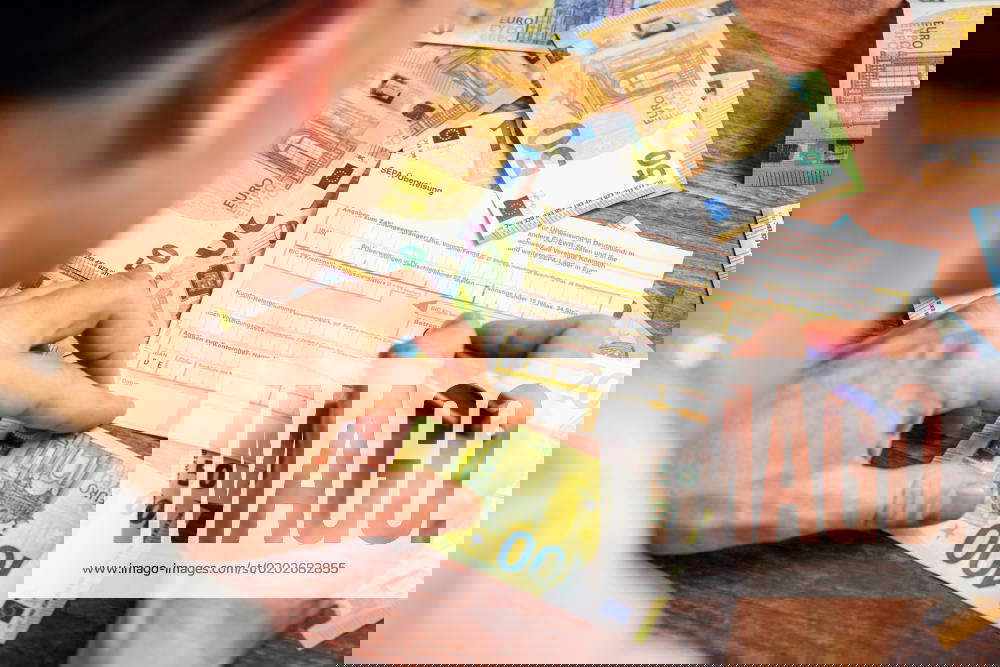 8 February 2023: A man makes a SEPA bank transfer. Bank transfer slip ...