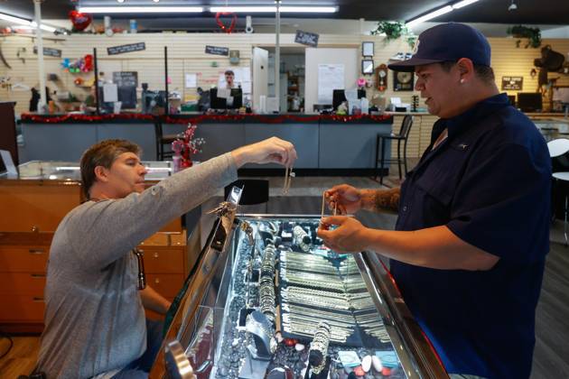 Largo, Florida, USA: Tim Kaye, owner, left, and Rita Casillas, a team ...
