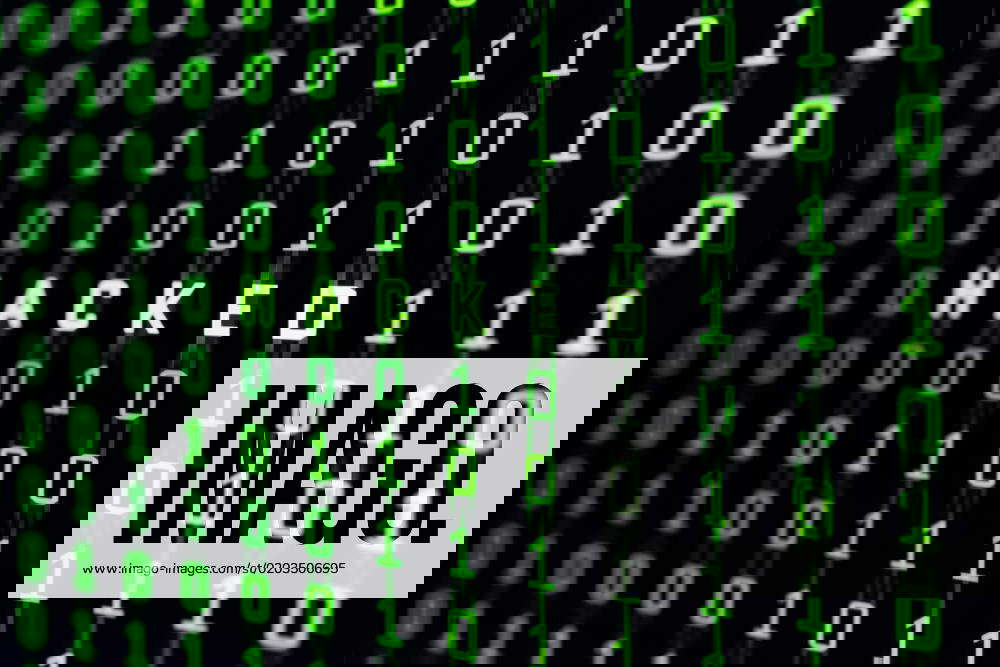 Hacked word on binary code background of a computer screen Hacked word on binary code background of